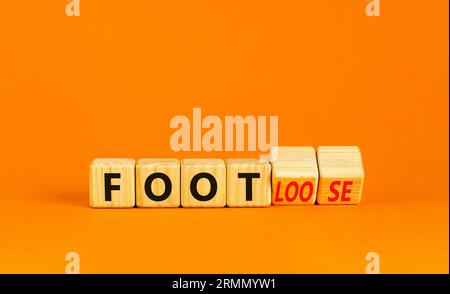 Foot or footloose symbol. Businessman turns wooden cubes and changes ...