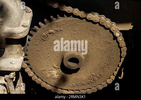 Rusty driving gears with metallic chain on a old mine train wagon for ...