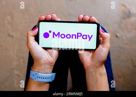 In this photo illustration, the MoonPay logo seen displayed on a ...