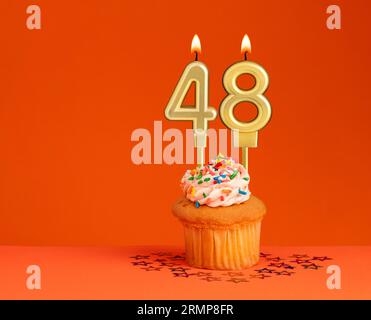 Birthday card - Number 48 candle in orange background Stock Photo - Alamy