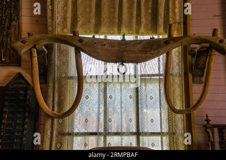 An antique wooden oxen yoke in the barn of the pioneer Cove Creek Ranch ...