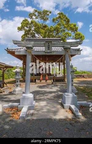 Japan, Kyushu. Torii Gate with Shimenawa Rope and Shide Paper Streamers ...