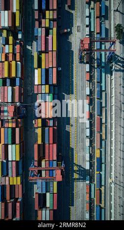 Stacked cargo containers top down aerial view. Containers at logistics ...