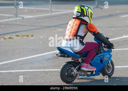 Girl Riding a Mini Moto Stock Photo - Alamy