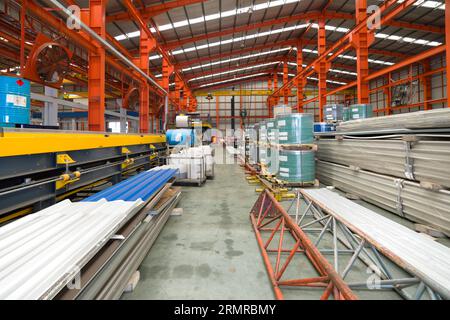 A gargantuan warehouse brims with a labyrinth of gleaming steel beams ...