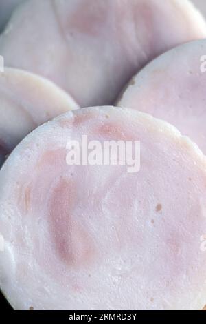 Sliced round-shaped ham from chicken meat, freshly sliced chicken ham ...