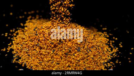 Pollen Dumplings Falling on Black Background, mortar and pestle Stock ...