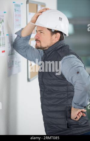 Builder, engineer, architect confuse at work. Confusing concept. Men ...