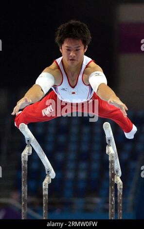 Yuya Kamoto of Japan during parallel bars for men at the 49th FIG ...
