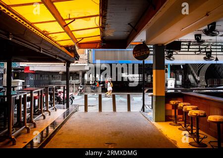 Looking through the some empty beer bars on to Walking Street, Pattaya ...