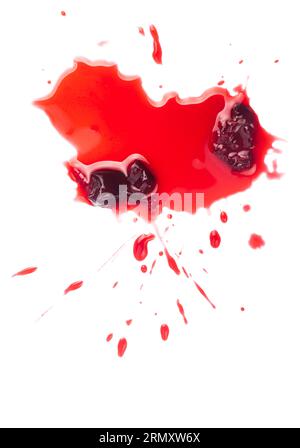 Squashed ripe sour cherry in the puddle of red juice isolated on white ...