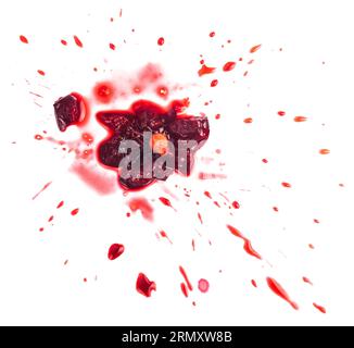Squashed ripe sour cherry in the puddle of red juice isolated on white ...