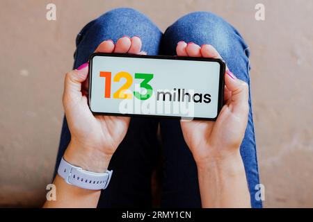In this photo illustration, the 123 Milhas logo is displayed on a ...