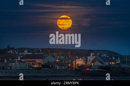 A rare super moon rises over the market town of Marazion, Cornwall 30 ...