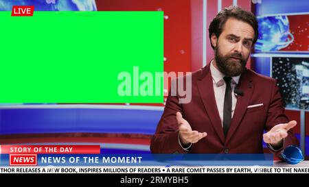 Newscaster does report with greenscreen on live tv program, presenting ...