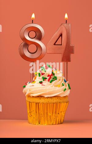 Candle number 84 - Cake birthday in rhodamine red background Stock ...