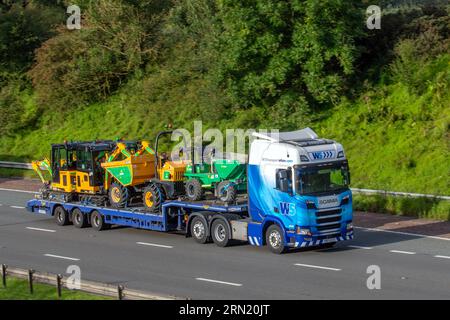 Scania Truck with low loader trailer Stock Photo - Alamy
