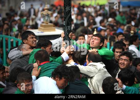 (150321) -- KABUL, March 21, 2015 -- Afghan people raise up a holy mace ...