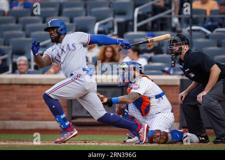 Texas Rangers' Adolis Garcia hits a sacrifice fly during the fifth ...