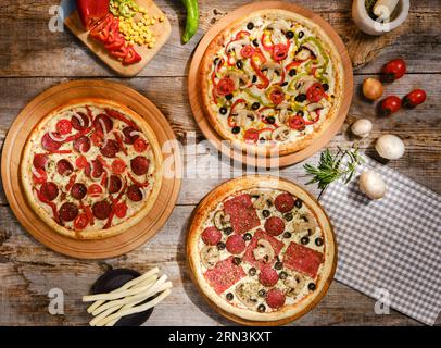 pizza photo shoot with top and side shots pizza on wooden board. Top ...
