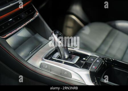 EV gear shift, a blend of form and function. Illuminated buttons beckon ...