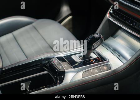 EV gear shift, a blend of form and function. Illuminated buttons beckon ...