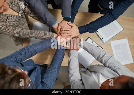 Successful business people stacking hands Stock Photo - Alamy