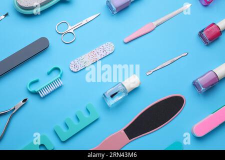 Set of pedicure tools on light blue background, flat lay Stock Photo ...