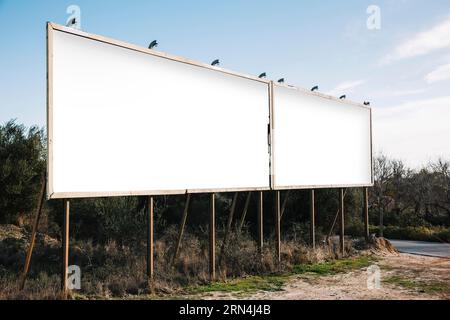 Empty white billboards suburban roadside Stock Photo - Alamy
