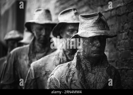 Statues depicting men in the Great Depression at the FDR Memorial in ...