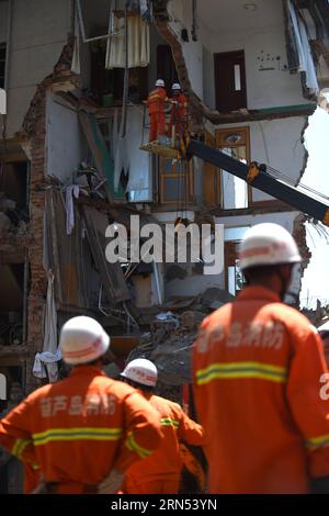 Rescuers work on the scene of a building damaged by a Russian attack in ...