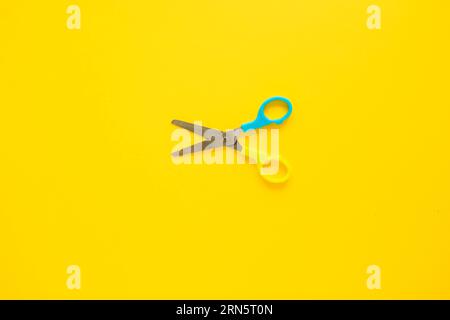 Opened scissors laid middle Stock Photo - Alamy