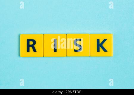 Risk word scrabble tiles Stock Photo - Alamy