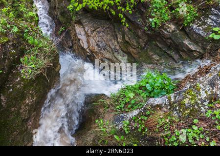 Fast river water at Honey waterfalls. This is a group of waterfalls on ...