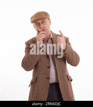 A mature Englishman in classic tweeds smoking a large cigar Stock Photo ...