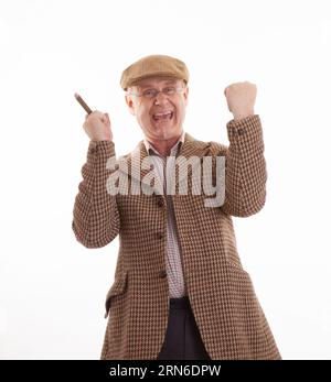 A mature Englishman in classic tweeds smoking a large cigar Stock Photo ...