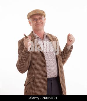 A mature Englishman in classic tweeds smoking a large cigar Stock Photo ...