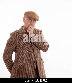 A mature Englishman in classic tweeds smoking a large cigar Stock Photo ...