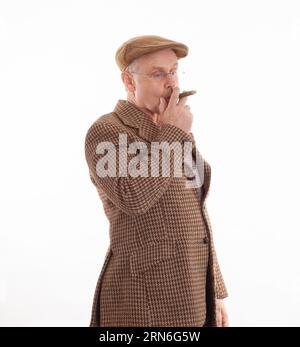A mature Englishman in classic tweeds smoking a large cigar Stock Photo ...