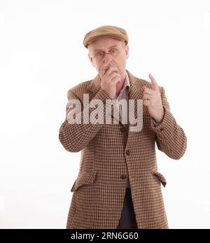 A mature Englishman in classic tweeds smoking a large cigar Stock Photo ...