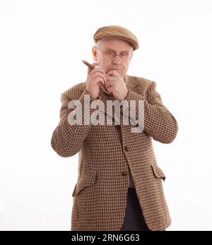 A mature Englishman in classic tweeds smoking a large cigar Stock Photo ...