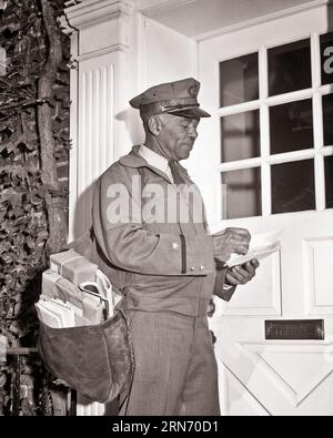 1960s AFRICAN-AMERICAN MAN MAILMAN RETRO CARRYING MAILBAG SORTING ...