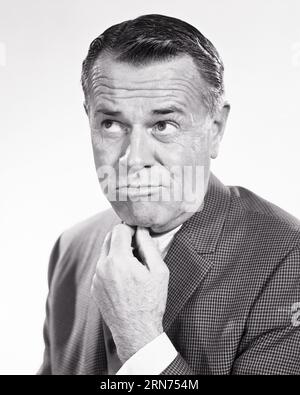 Black man scratching his chin Stock Photo - Alamy