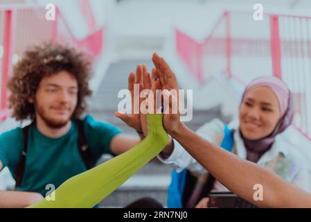 A diverse group of students symbolizes unity as they interlace their ...