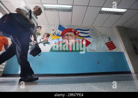 A man walks past a mural of the late Kenyan environmentalist Wangari ...