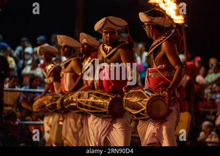 Kandy, Homagama, Sri Lanka. 30th Aug, 2023. A fire spinner takes part ...