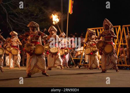 Kandy, Homagama, Sri Lanka. 30th Aug, 2023. A fire spinner takes part ...