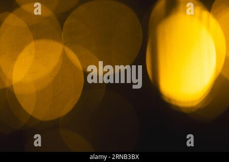 Yellow bokeh lights with copy space on dark background Stock Photo - Alamy