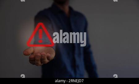 Hacking Concept. Attention warning attacker alert sign with exclamation mark on dark red ...