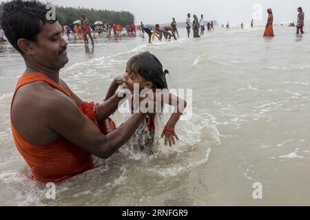 Indian Hindu devotees take a holy dip at Sangam, the confluence of the ...